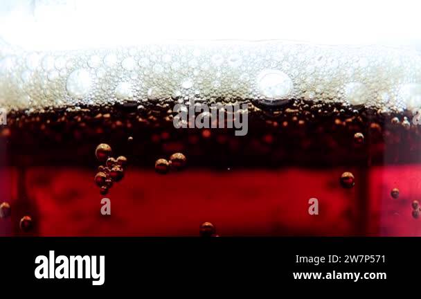 air bubbles in dense foam on the surface of an alcoholic beverage Stock ...