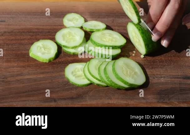 Hand cut cucumber knife Stock Video Footage - Alamy