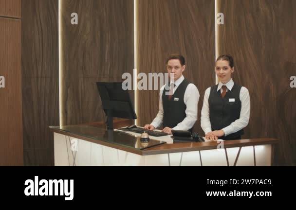 Portrait two receptionists hotel reception Stock Videos & Footage - HD ...