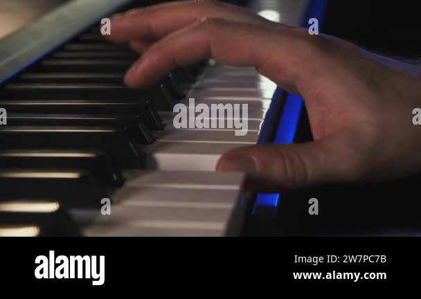 Musician plays piano during a live performance. right hand playing keys ...