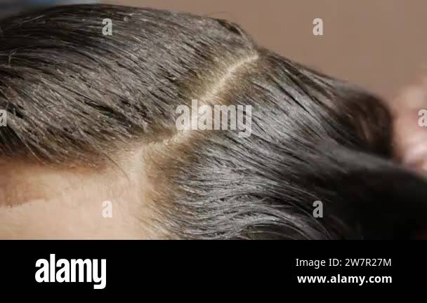 Dyeing female hair in a dark color in a hairdressing salon. hairdresser ...