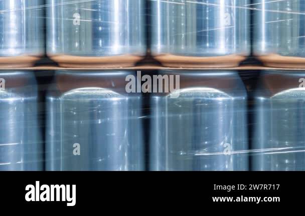 Empty beer cans for cold beverage stored on pallet rack in industrial ...