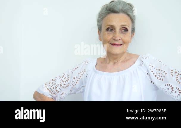 Beautiful Old Grandmother With Grey Hair And Face With Wrinkles Is