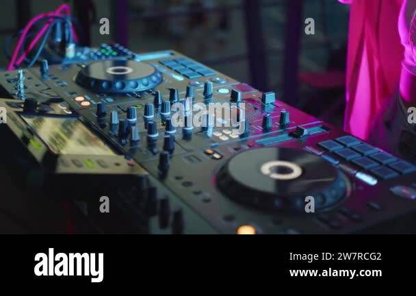 Close up. DJ sound control console for mixing dance music in disco club ...