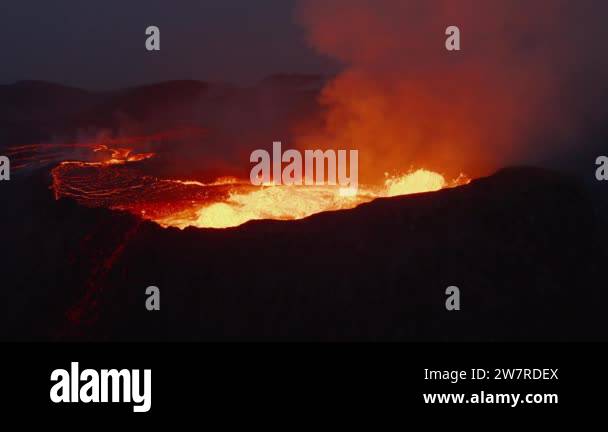 High angle view of active volcano. Amazing view of magma splashing into ...