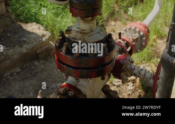 Pressure gauges and oil-stained pipeline pipes. The work of an oil pump ...