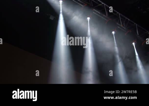Four white projectors on the stage lights farm. Bright shiny stage ...