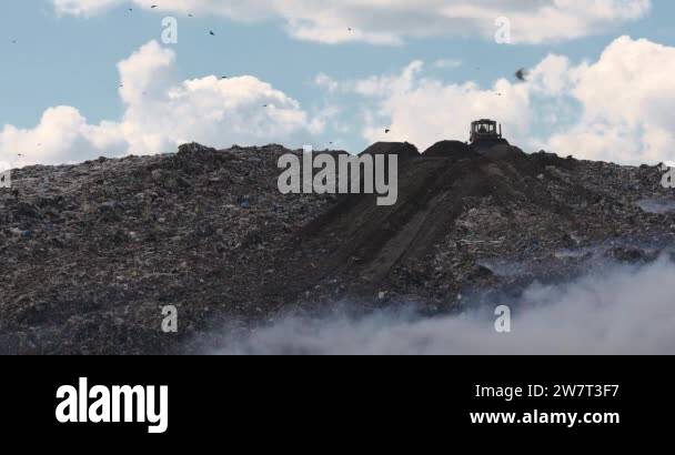Air pollution caused by fire on dump site. Clouds of smoke above the ...