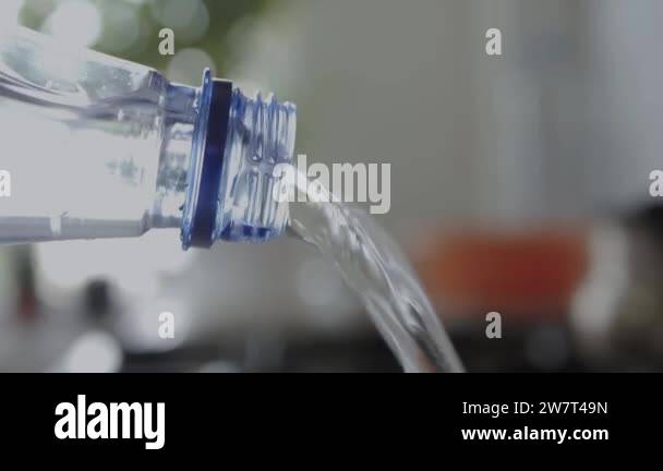Thirsty Person Pouring Clear Water from a Plastic Bottle. Cold and Fresh Water Flowing from a ...