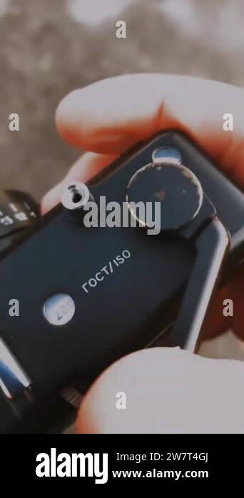 Old Film Camera Trigger. "Cocking the trigger" on an old film camera ...