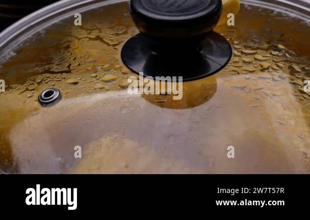 Boiled cassava in a pot with boiling water to making Thai dessert ...
