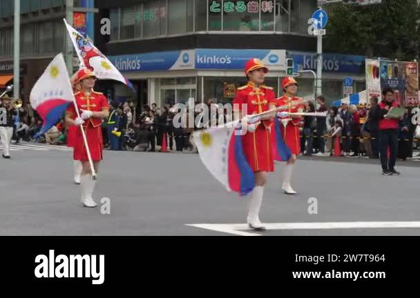 Majorettes holding the flags in Nihonbashi-Kyobashi Matsuri festival in ...