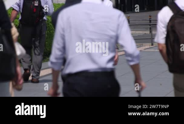 A slow motion of body parts of walking people at urban city in Tokyo ...