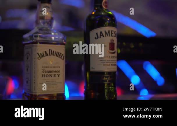 Bottles of alcohol Jack Daniels and Jameson are on table in a nightclub ...