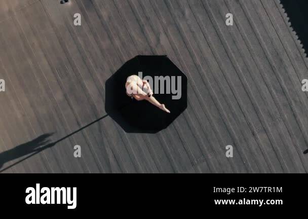 pole dance. aero. top view. fit female gymnast, in beige leotard ...