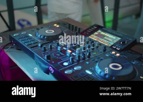 Close up. DJ sound control console for mixing dance music in disco club ...