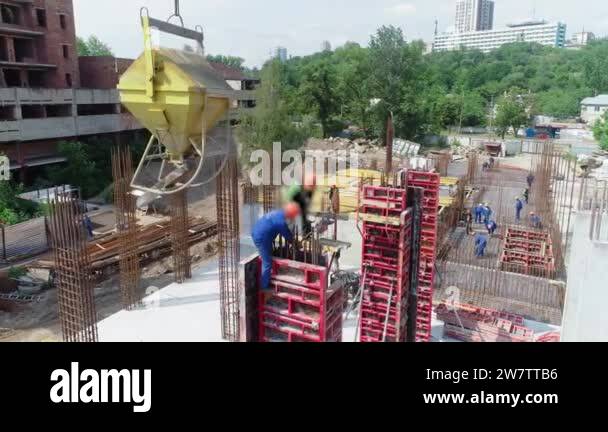 Construction of a modern residential complex. Workers at a construction ...