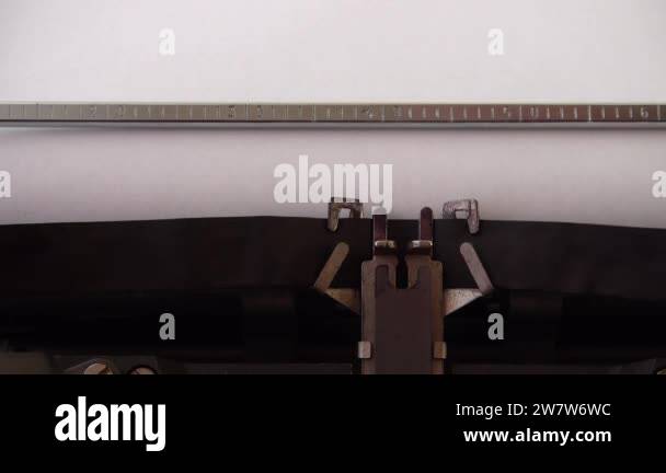 Typing alphabet letters A B C D E on retro typewriter. Close up Stock ...