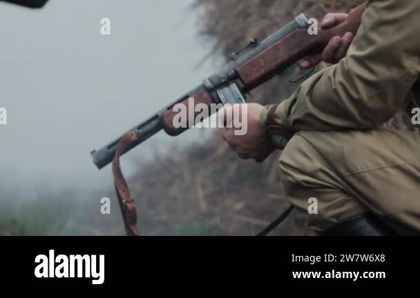 Red Army soldier in soviet uniform with submachine gun PPSh-41 go to ...