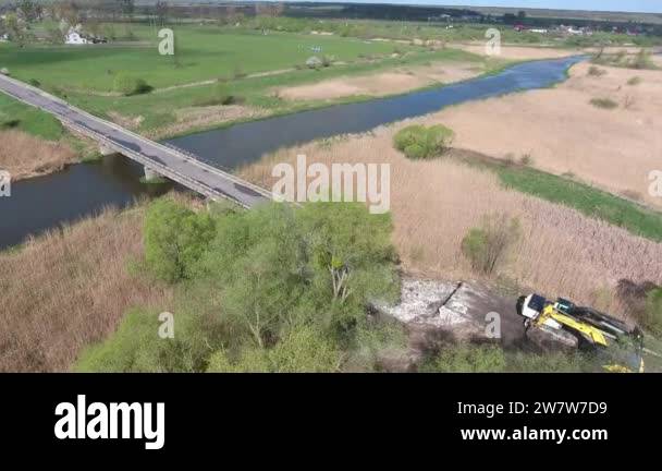 Road collapse, automobile bridge excavator hydraulic crushes concrete ...