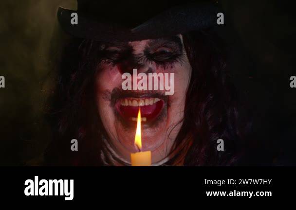 Sinister Old Mature Woman In Carnival Costume Of Halloween Witch Making