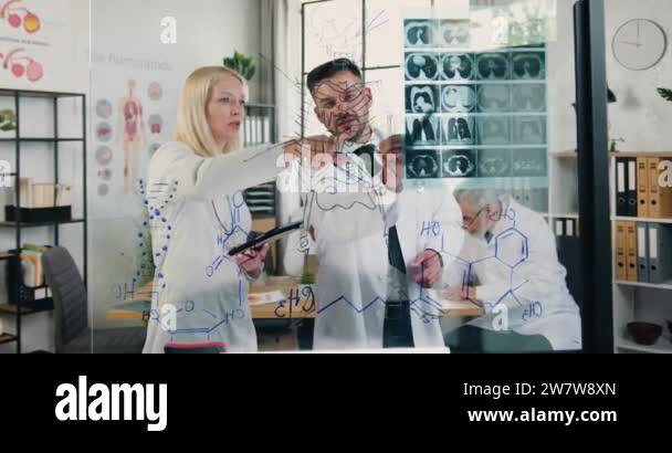 Attractive high-skilled successful male and female doctors working ...