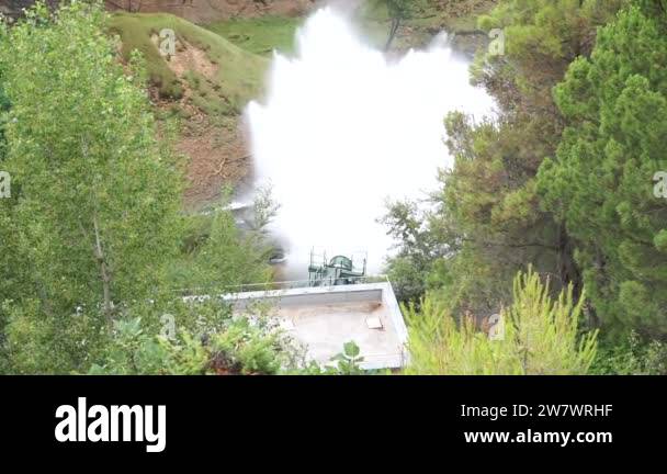 Water dam drained by an outlet pipe of the dam where the electrical ...