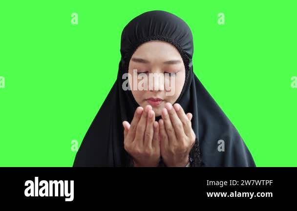 50p frame rate footage of Young Muslim women praying for the blessing ...