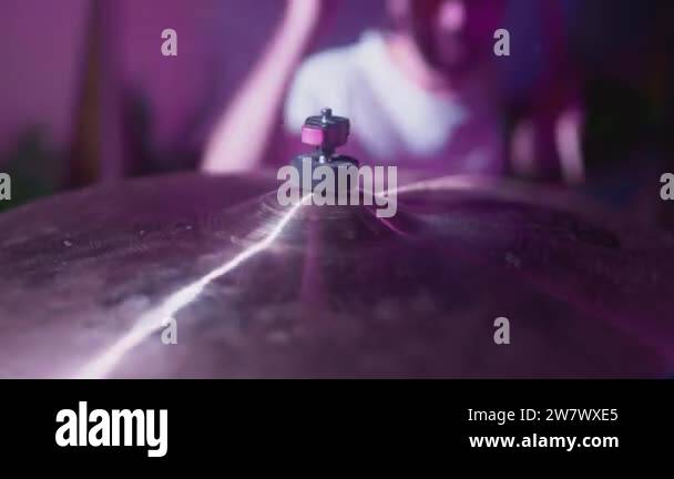 A professional male artist plays a drum kit. Night show in a musical ...