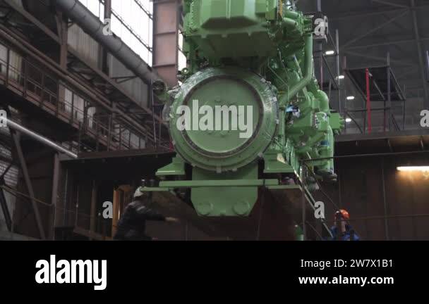 Process of installing new ship motor into crab vessel hold Stock Video ...