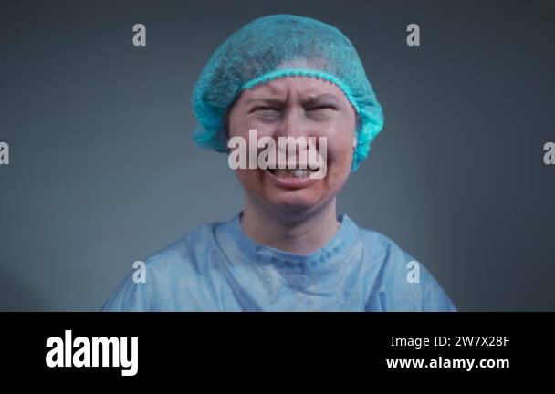 Stressful tear-stained woman with injuries to her face and teeth cries ...