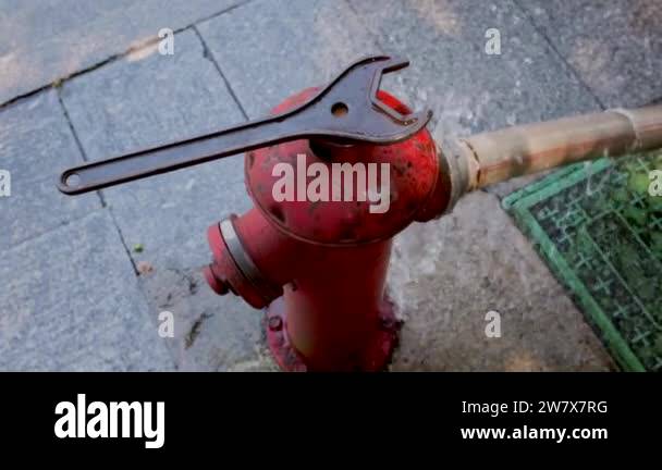 Broken red fire hydrant that is squirting water Stock Video Footage - Alamy