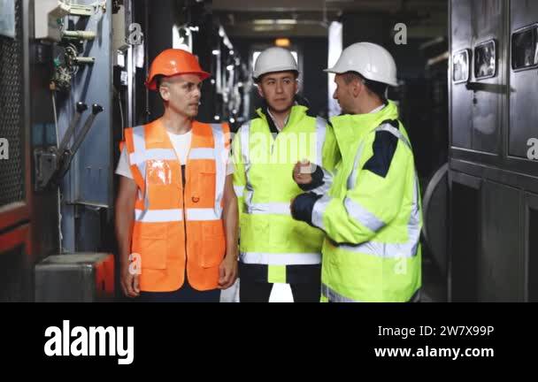 Group of three engineer team with perfect safety uniform brainstorming ...
