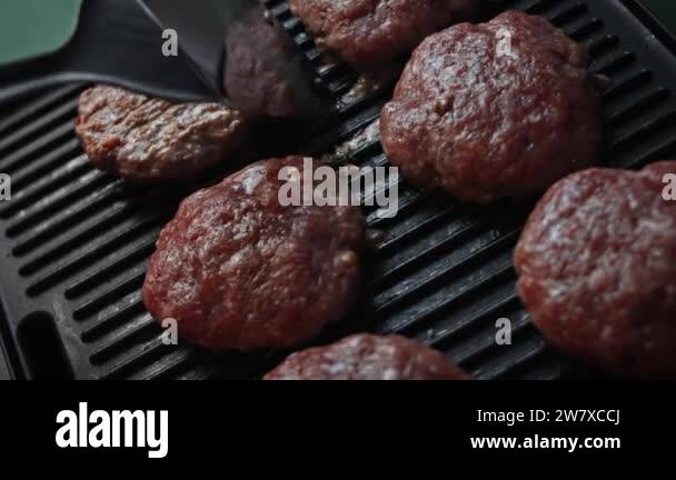 Fry the beef patties on the grill. Taste Classic American burger. 4k ...