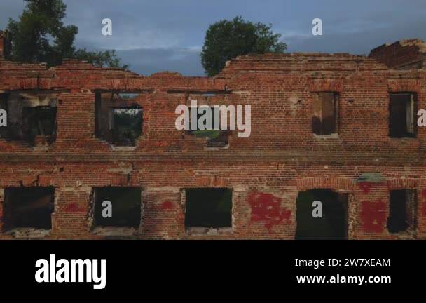 Flying through the window openings of an old ruined building. Destroyed ...