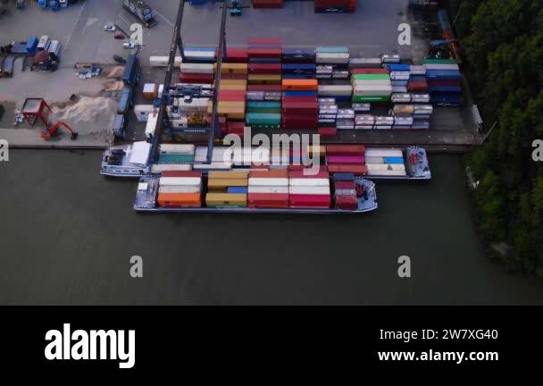 Aerial Top Down View Of Gantry Crane Moving Cargo Containers At Loading ...