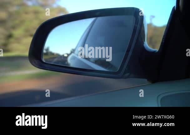 passenger perspective of a car driving on the road through Western ...