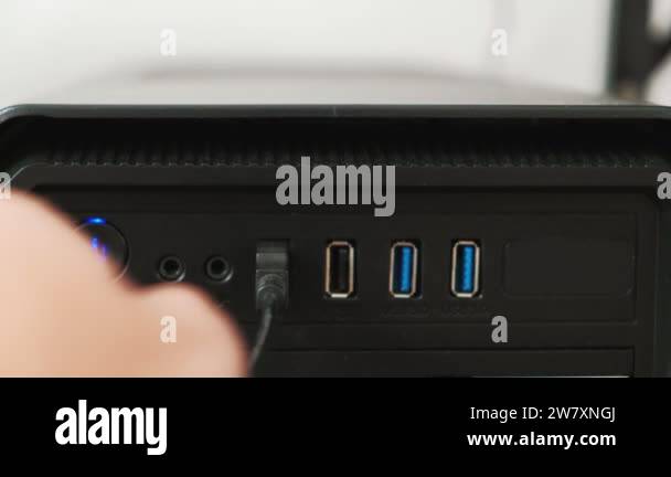 Close-up footage on front: USB cable unplugged from port to disconnect ...