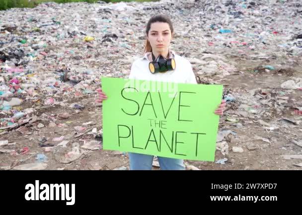 portrait young woman activist with a poster in hands save earth stands ...