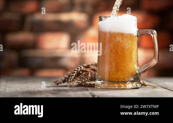 Super slow motion of pouring beer into glass, old cellar interior ...