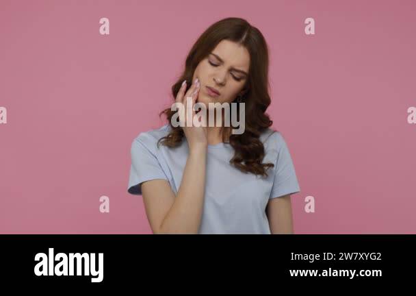 Dental problems. Unhealthy teenager girl pushing and rubbing cheek ...