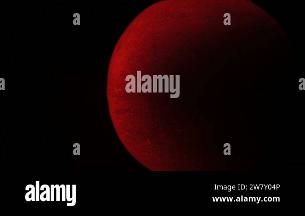 The planet Mars is flying in outer space. Close-up of the red planet is ...