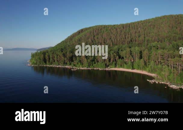 Summer evening aerial landscape of Lake Baikal is a rift lake located ...