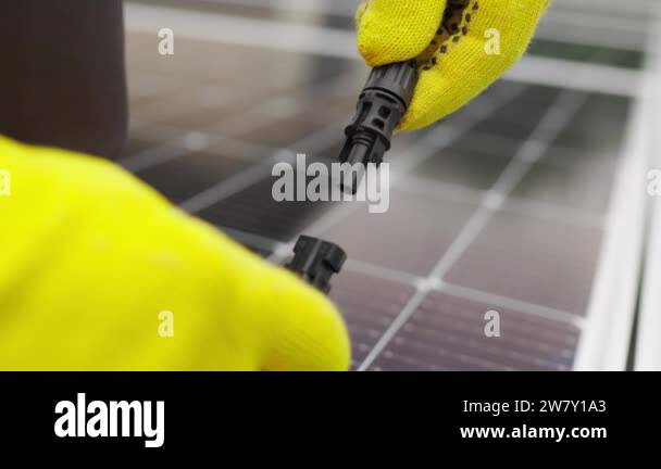 Close up of connecting electric cable to solar panels. Connection and ...
