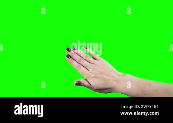 Female Caucasian hand waving on greenscreen. Finger gestures on chroma ...