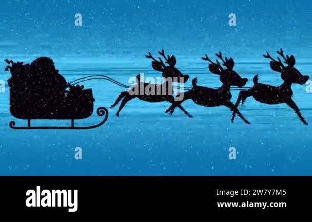 Snow falling over santa claus in sleigh being pulled by reindeer and ...