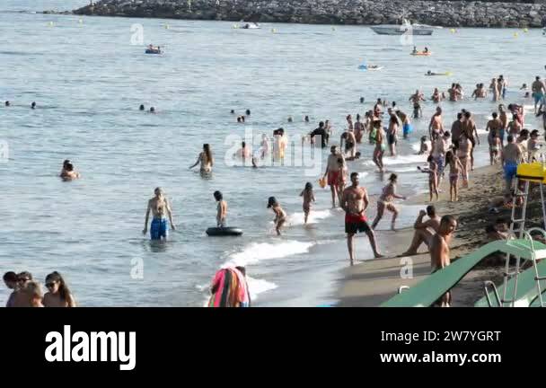 Beaches of southern Spain and swimmers crowded on a summer afternoon ...