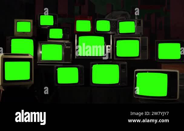 Stack of Retro Television Sets Turning On Green Screens. You can ...