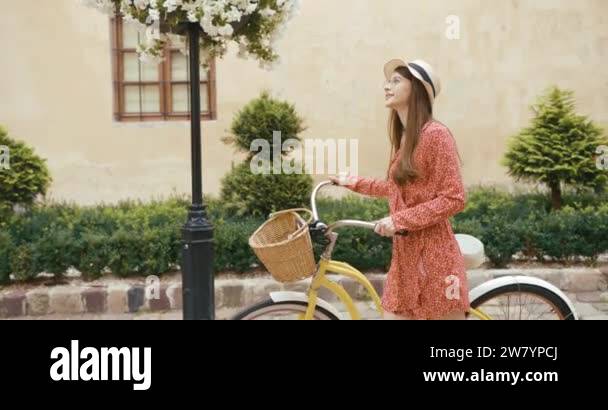 Young fermale tourist in old European town. Charming young woman in red ...