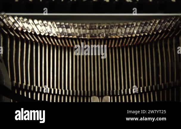 Mechanism of a retro typewriter. Old typewriter hammers. Slow motion ...